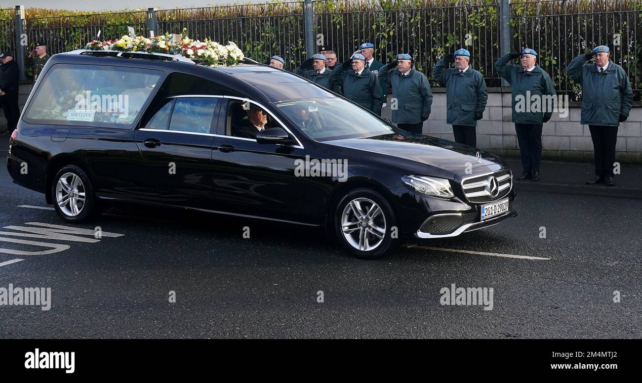 Irish UN veterans salute the hearse carrying the coffin of Private Sean ...