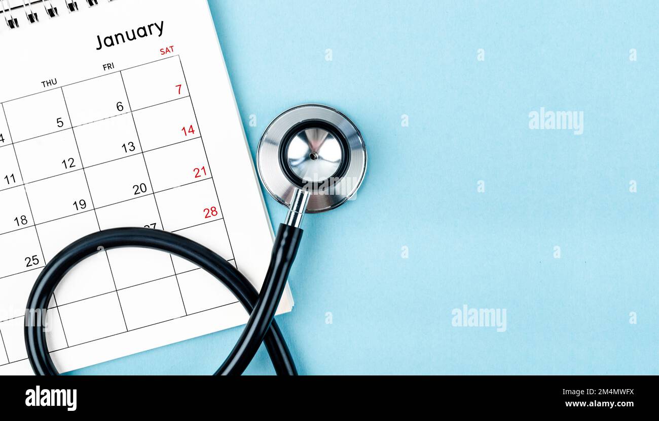 Stethoscope medical and calendar with empty space on the blue ...