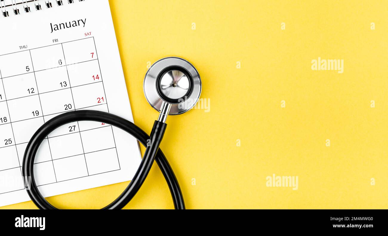 Stethoscope medical and calendar with empty space on the yellow ...
