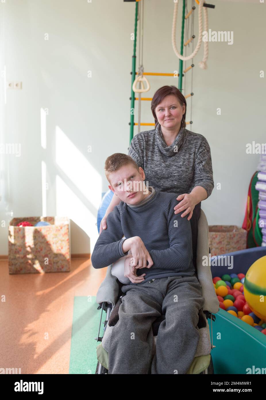 a boy with a disability in a rehabilitation center with special needs ...