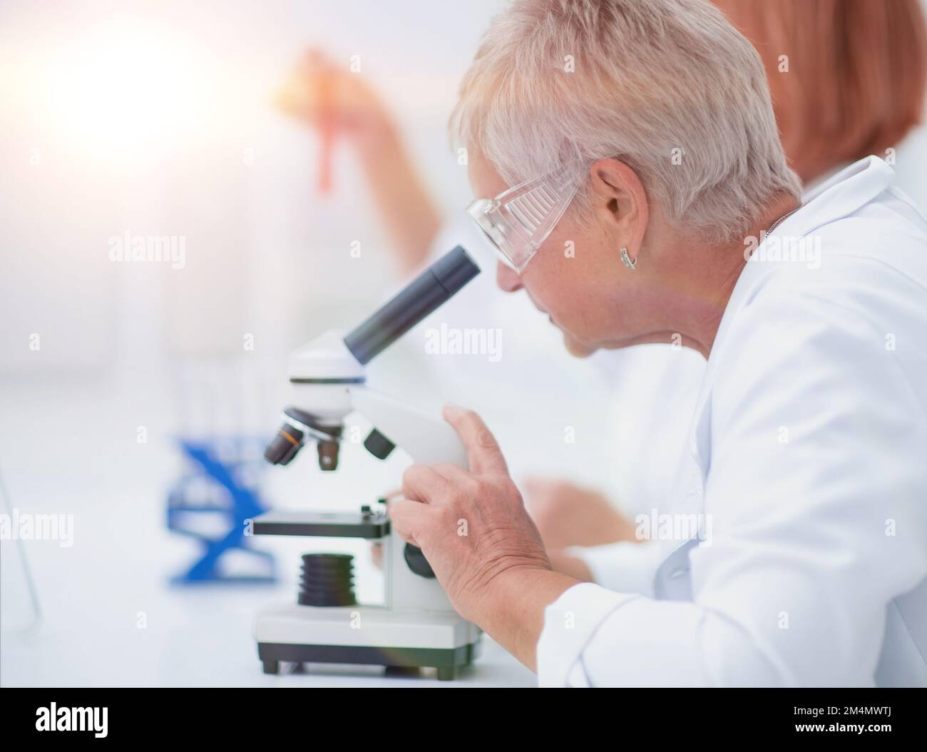 Woman scientist in lab conducts hi-res stock photography and images - Alamy
