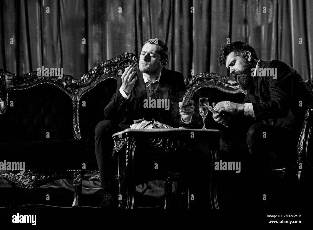 Gangsters with money, alcohol and cigarette. Success and confidence ...