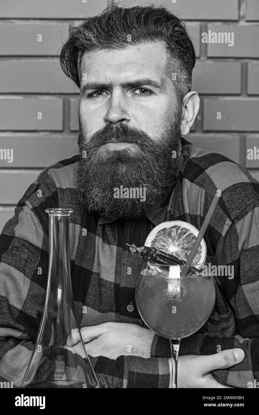 Barman with long beard and mustache and stylish hair with strict face ...