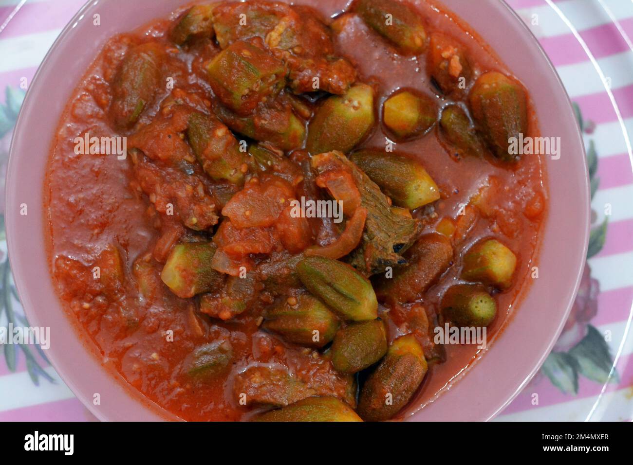 Okra cooked with beef meat pieces and tomato sauce, Bamia, bamya or ...