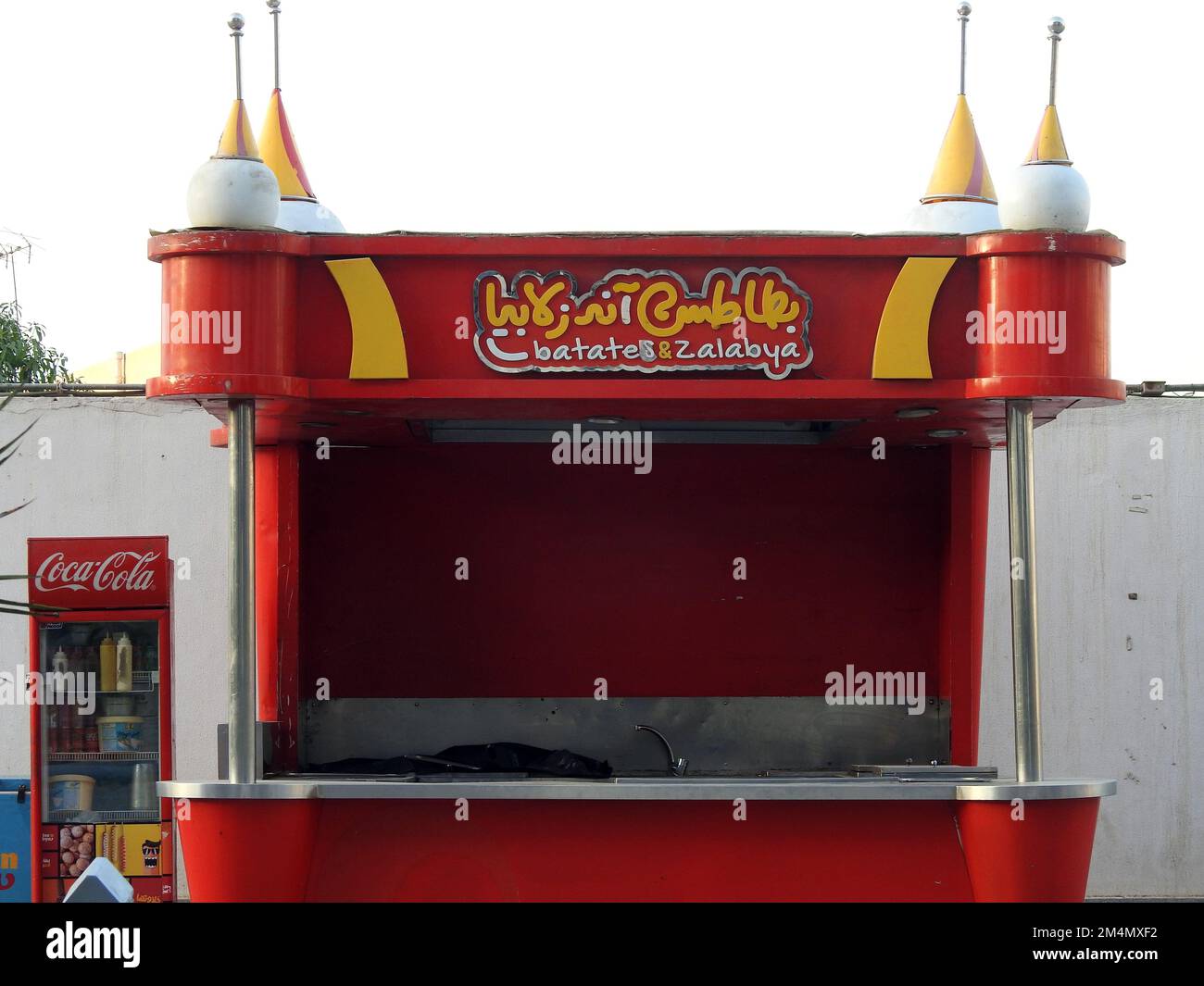 Cairo, Egypt, December 10 2022: Batates and Zalabya or potatoes and ...