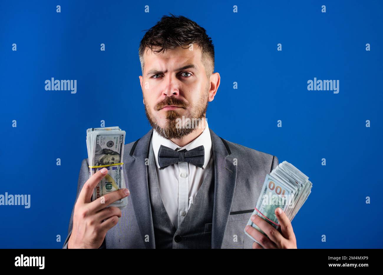 Easy cash loans. Man formal suit hold pile of dollar banknotes blue ...