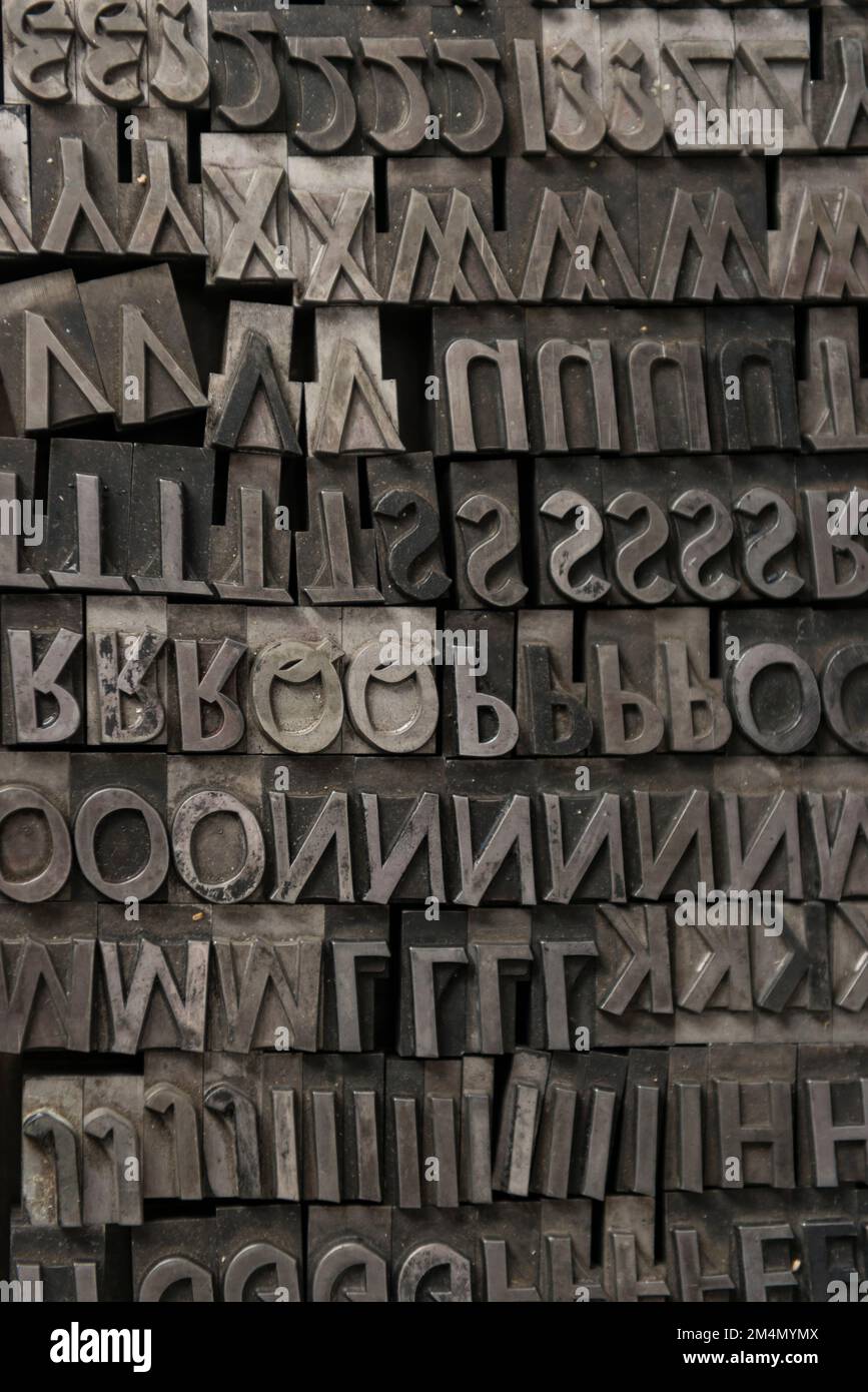 A vertical shot of metal-type letters in rows, shapes and forms of an ...