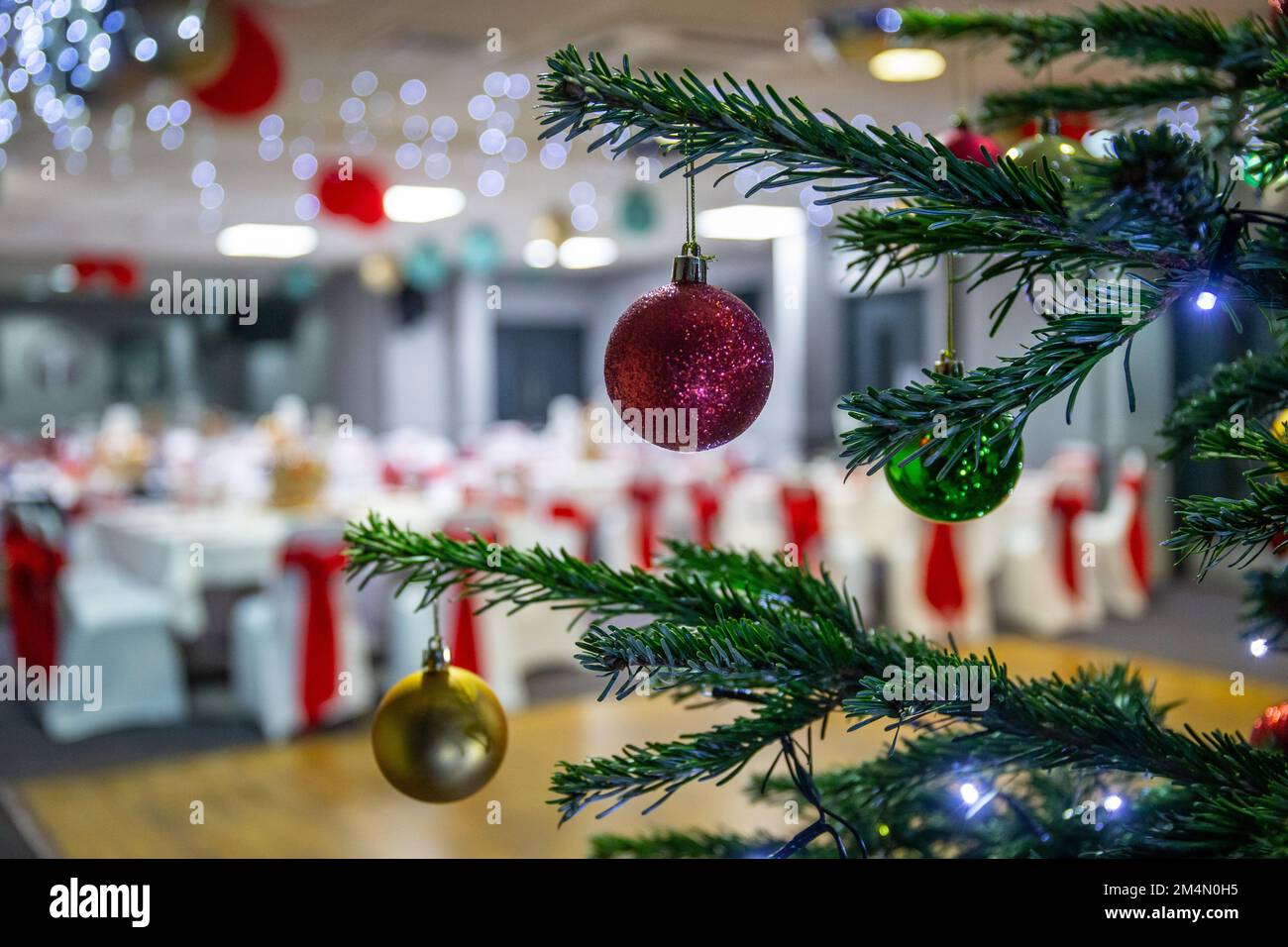 Christmas tree in function room set up for Christmas party event during ...