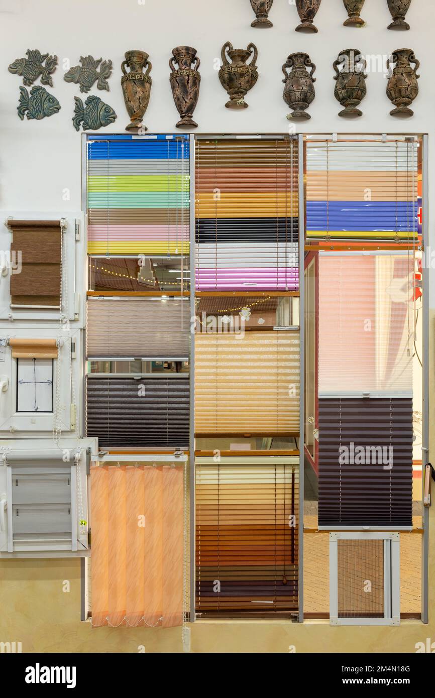Samples of blinds for windows in the store. Plastic blinds, pleated ...