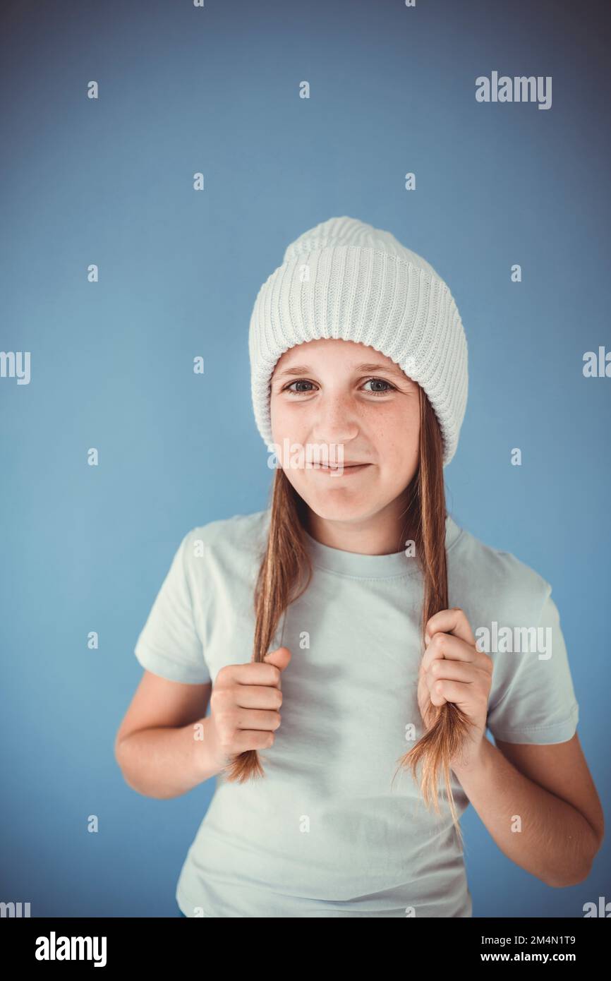 cool and pretty girl with winter wool beanie is standing in front of ...