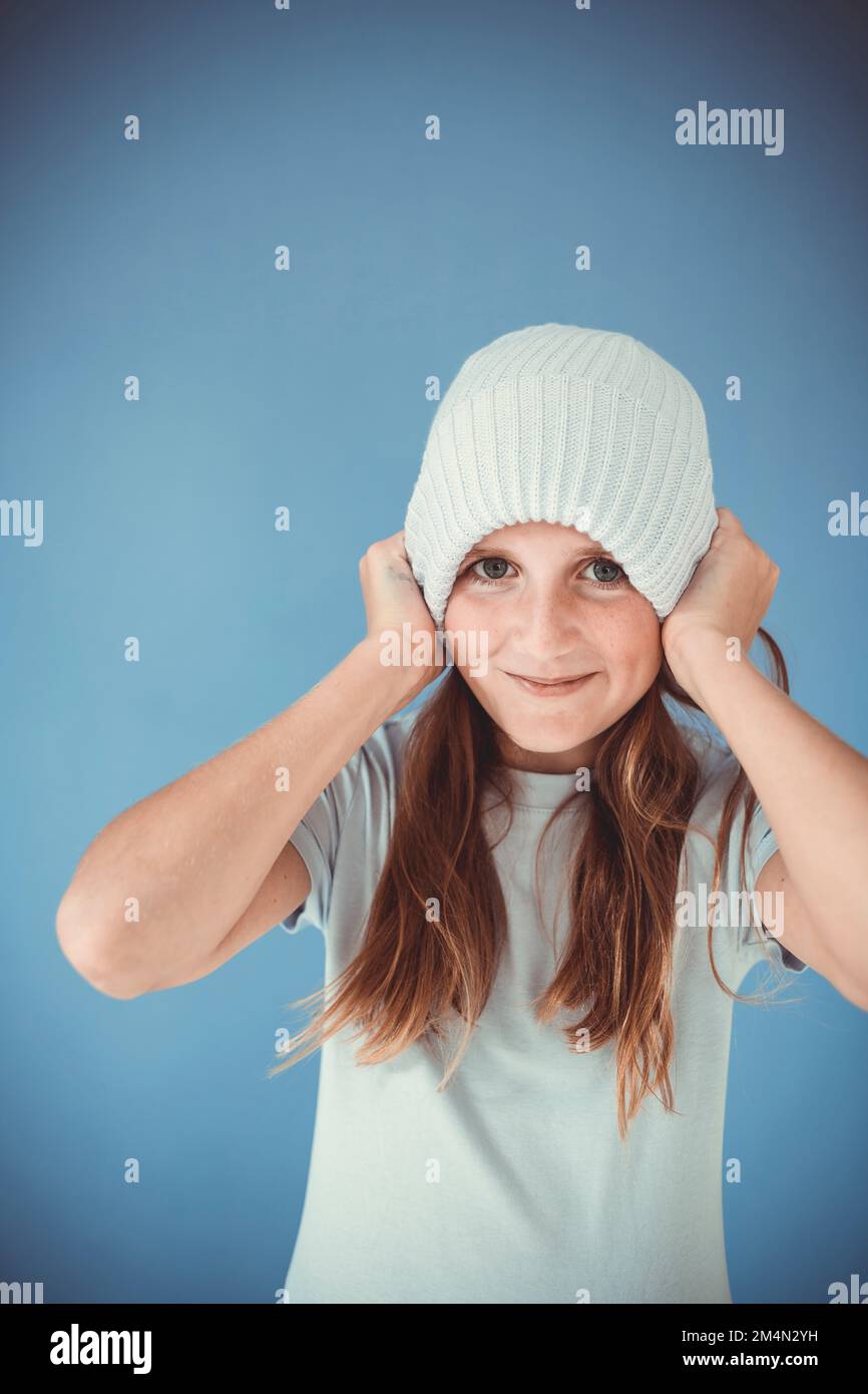 cool and pretty girl with winter wool beanie is standing in front of ...