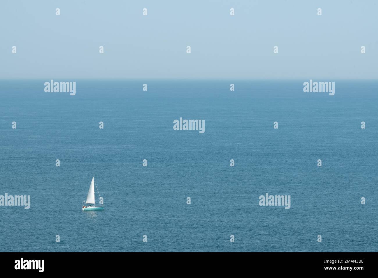 Lone Sail Boat in open sea, blank space Stock Photo - Alamy