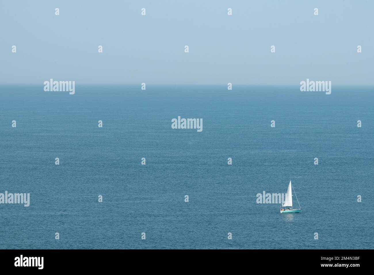 Lone Sail Boat in open sea, blank space Stock Photo - Alamy