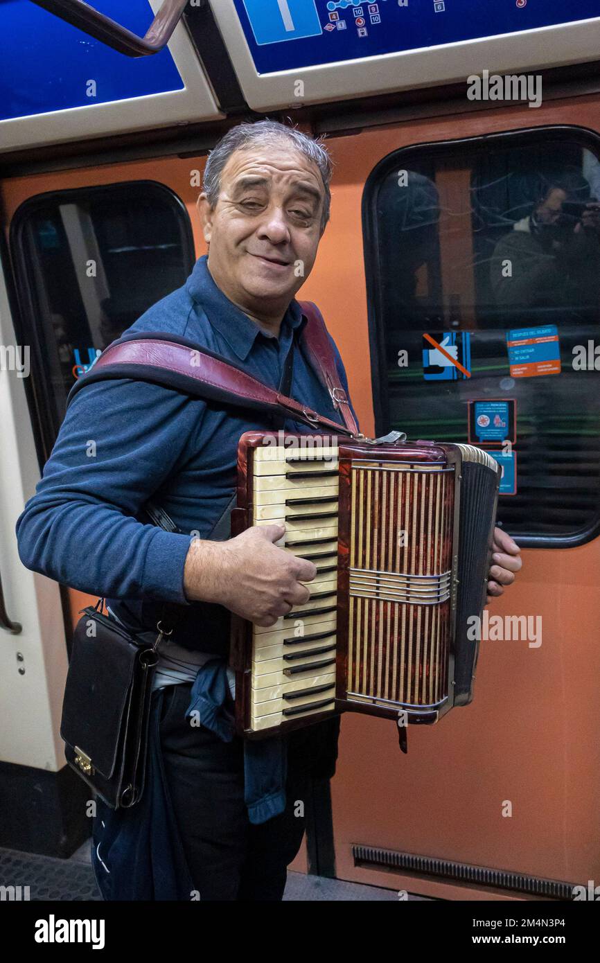 Street Musician plays music in the Metro of Madrid. December 22, 2022 ...