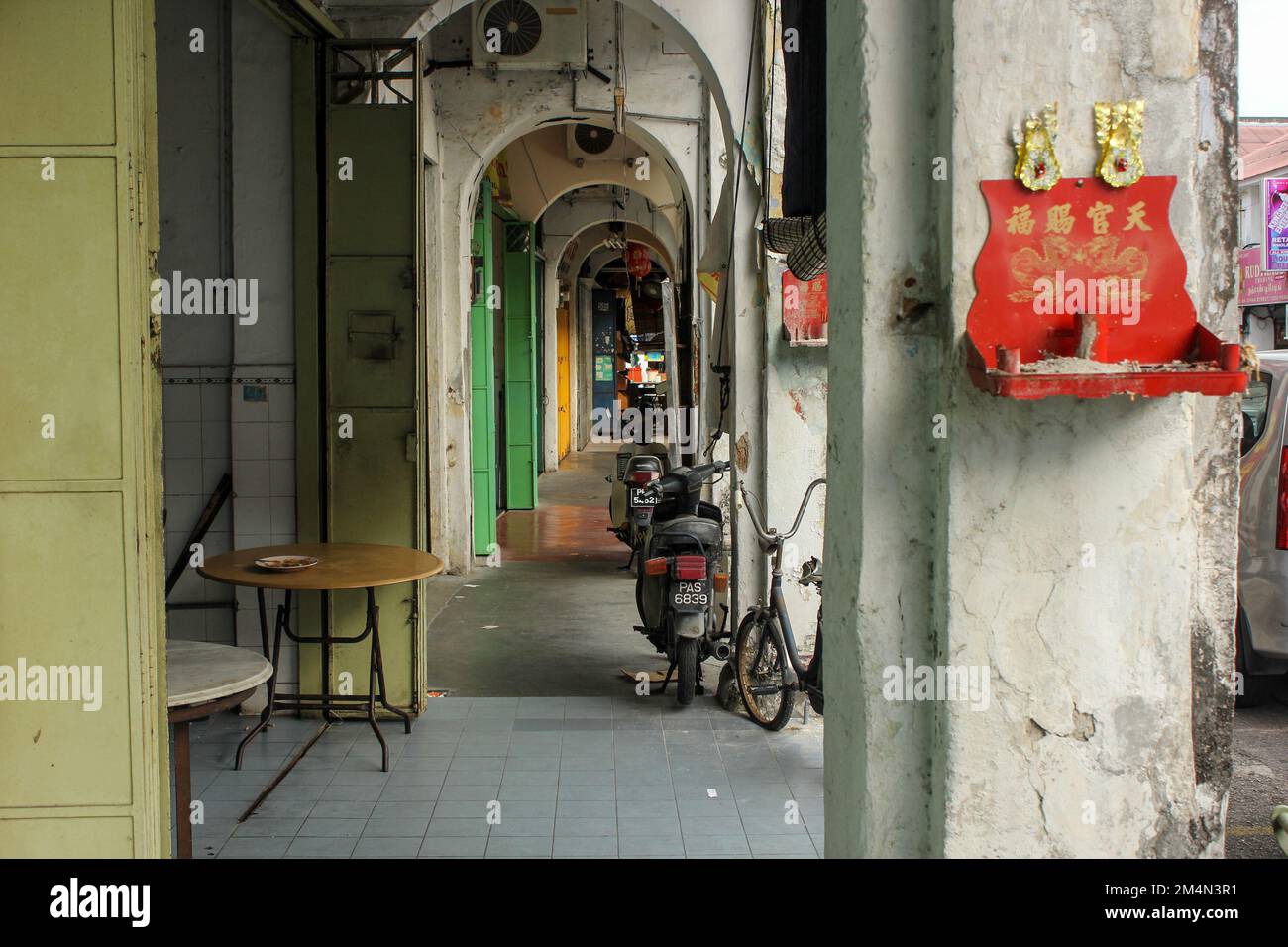 Georgetown, Penang, Malaysia - November 2012: An arcaded alley lined ...