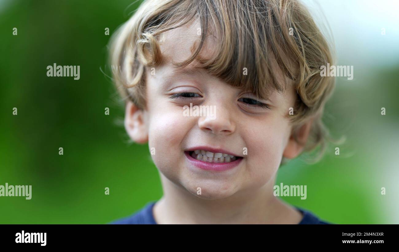 Child grimacing to camera cute little boy portrait growling Stock Photo ...