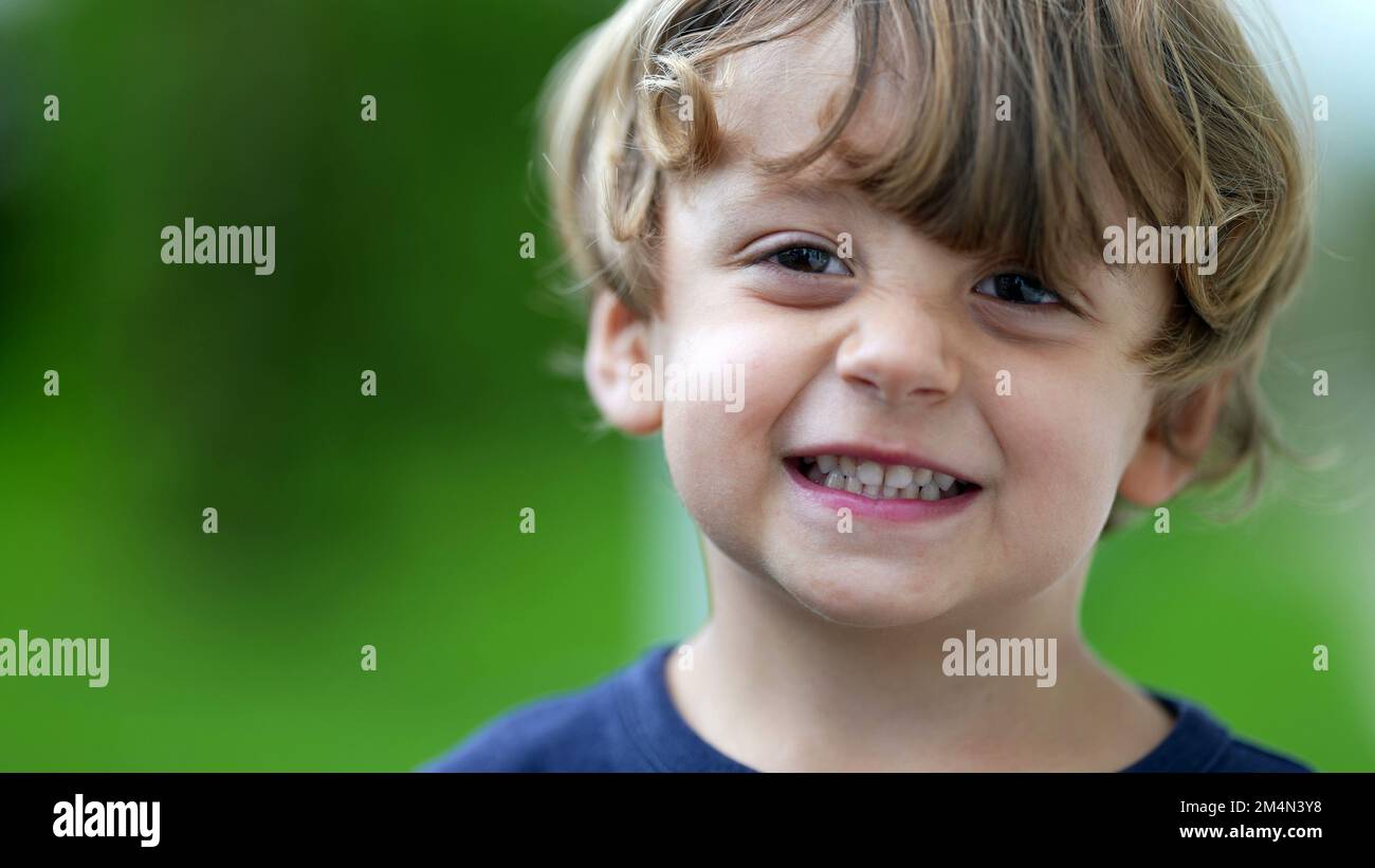 Child grimacing to camera cute little boy portrait growling Stock Photo ...