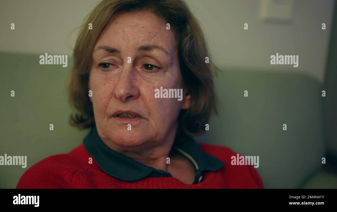 Concerned older woman portrait face closeup with worried expression ...