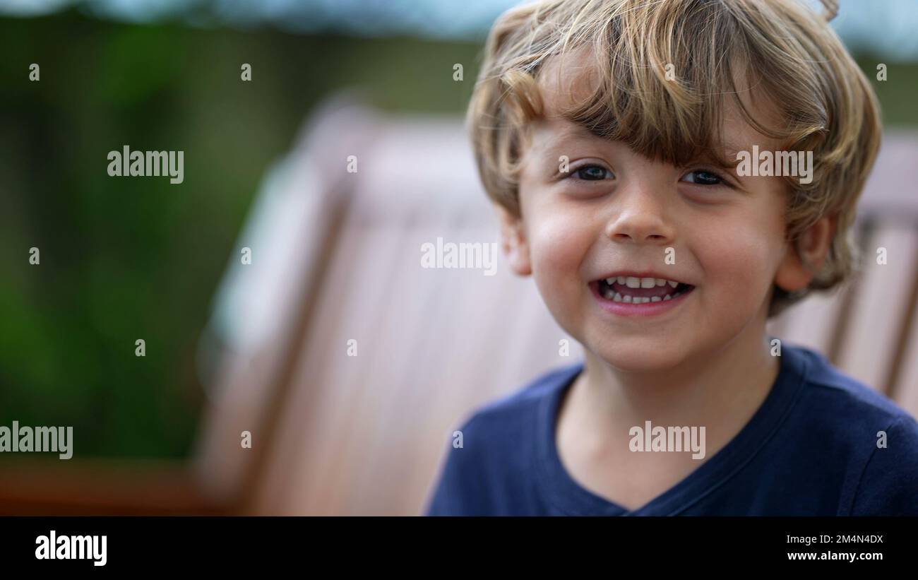 Portrait of a happy little boy. Small child face closeup laughing and ...