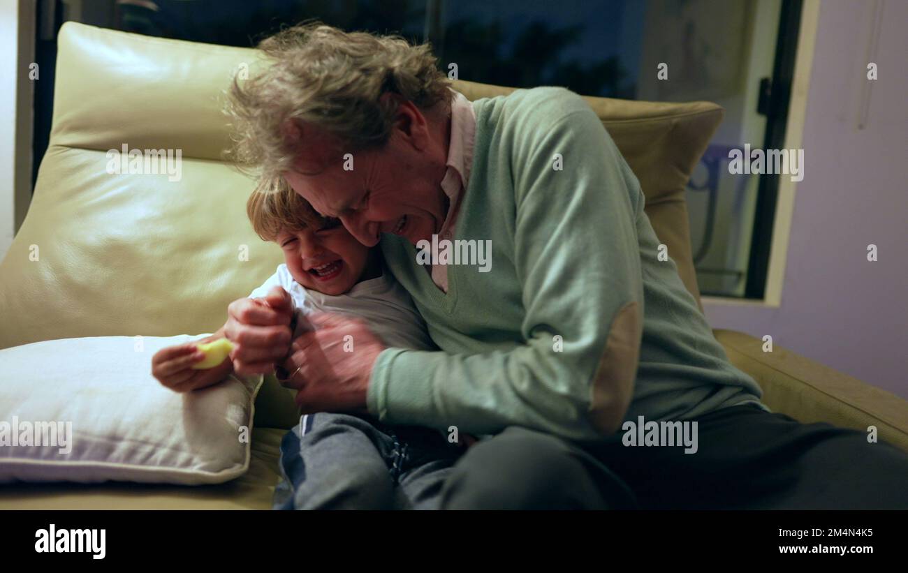 Grandfather and grandchild relationship. Grandparent hugging grandson ...