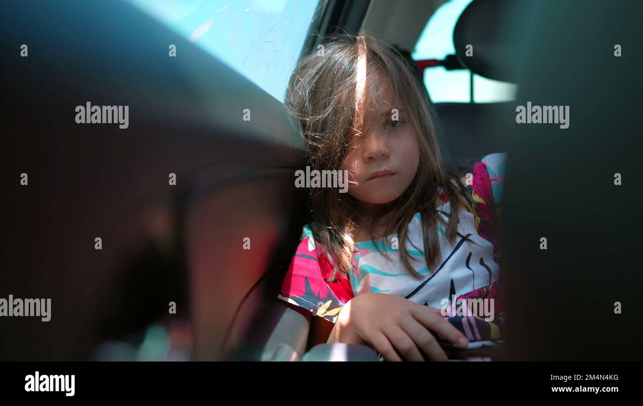 Small girl child closing eyes while traveling by car transportation ...