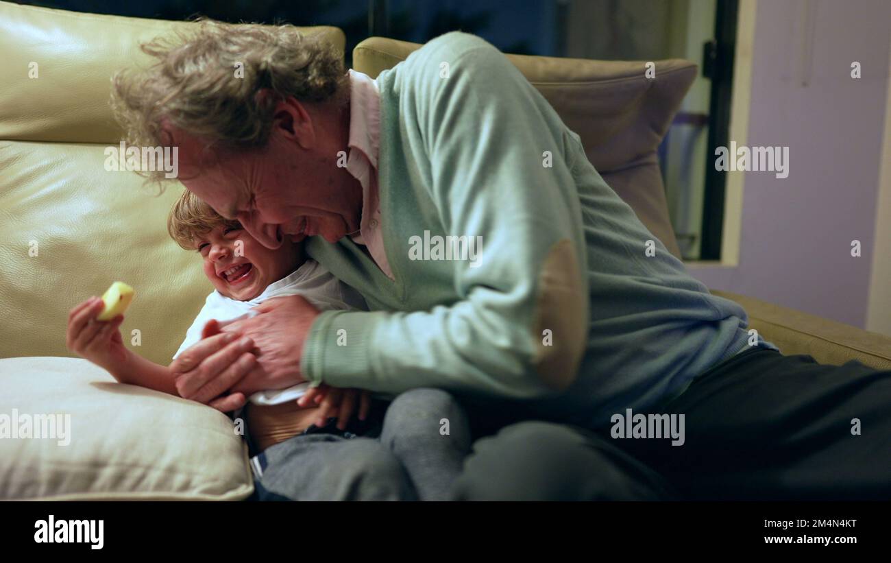 Grandfather and grandchild relationship. Grandparent hugging grandson ...