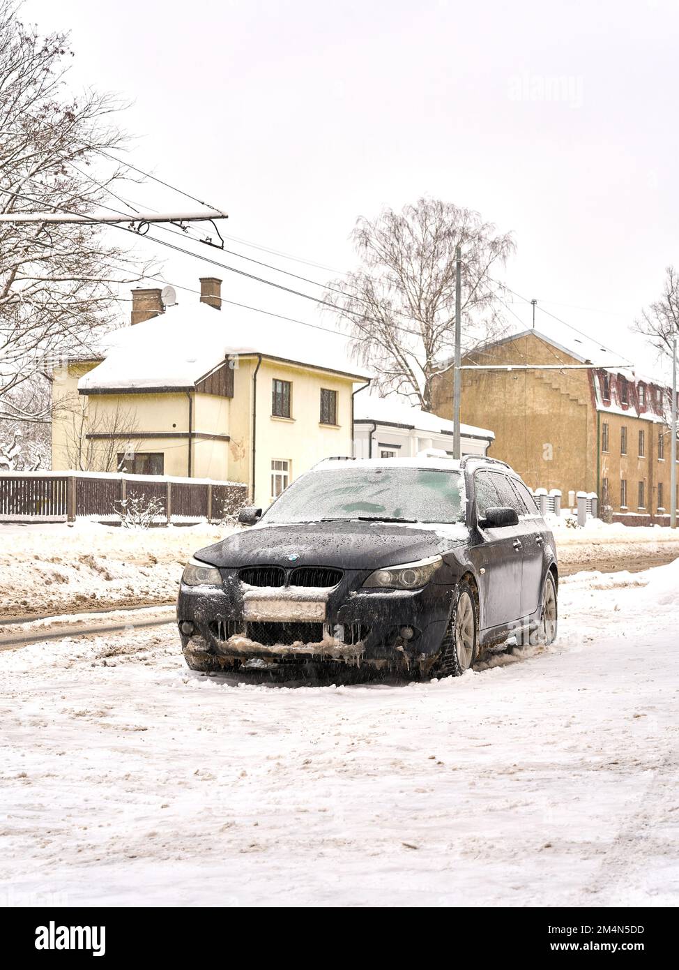 Riga, Latvia - 13 December, 2022: Frozen BMW car covered with ice layer ...