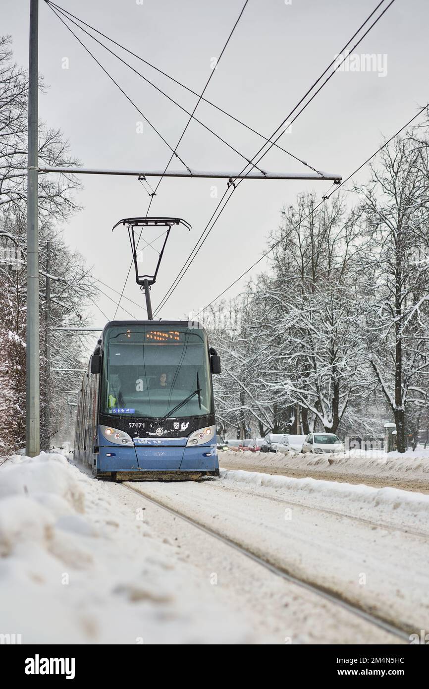 Riga, Latvia - December 13, 2022: Modern tram moving on the snowy ...