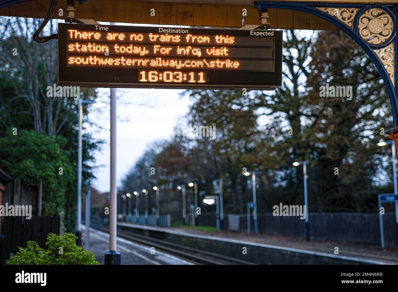 A deserted platform and a sign announcing that there are no trains at ...