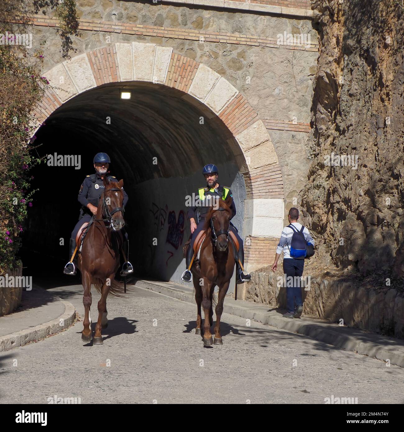 Spanish police on horses patrol near the Alcazaba Tunnel, Malaga,Spain ...
