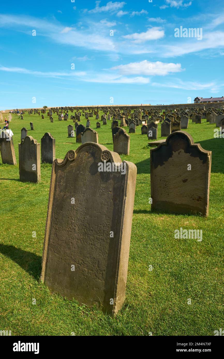 Vast cemetery overlooking the harbor in Whitby, East Yorkshire, UK ...