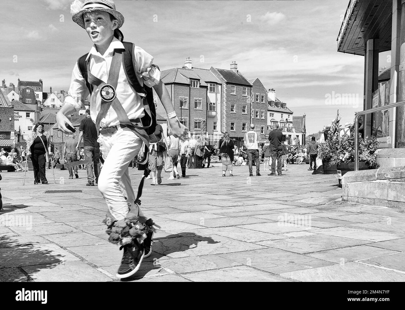 Boy in costume running on a pavement in Whitby, Yorkshire, UK Stock ...