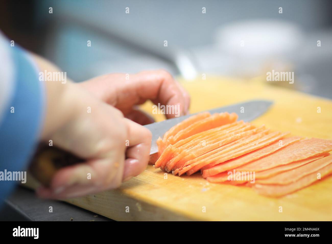 close up. chef slicing fish for sushi Stock Photo - Alamy