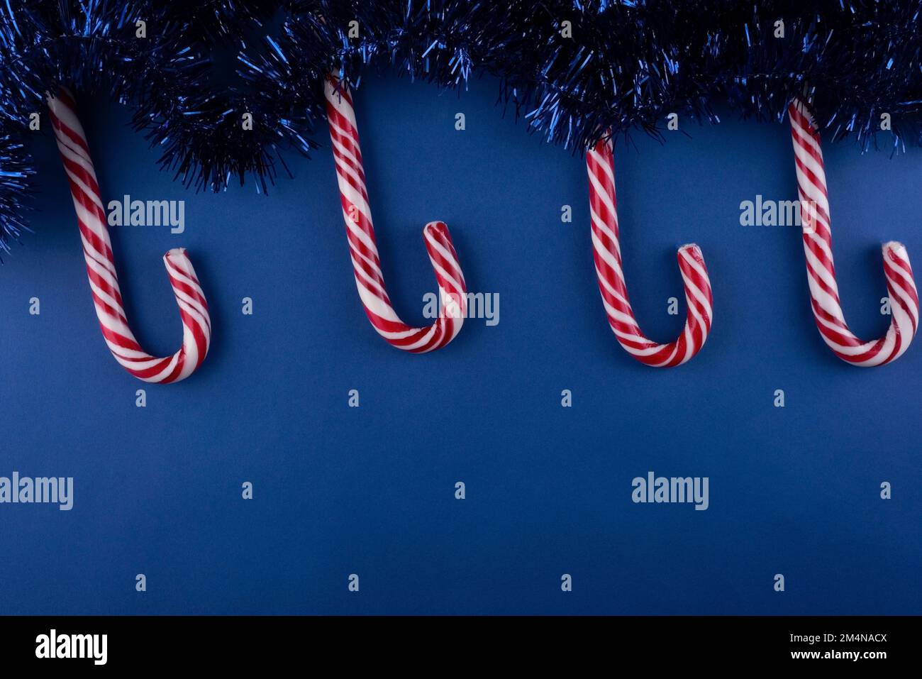 christmas background lollipops on blue background gifts Stock Photo - Alamy