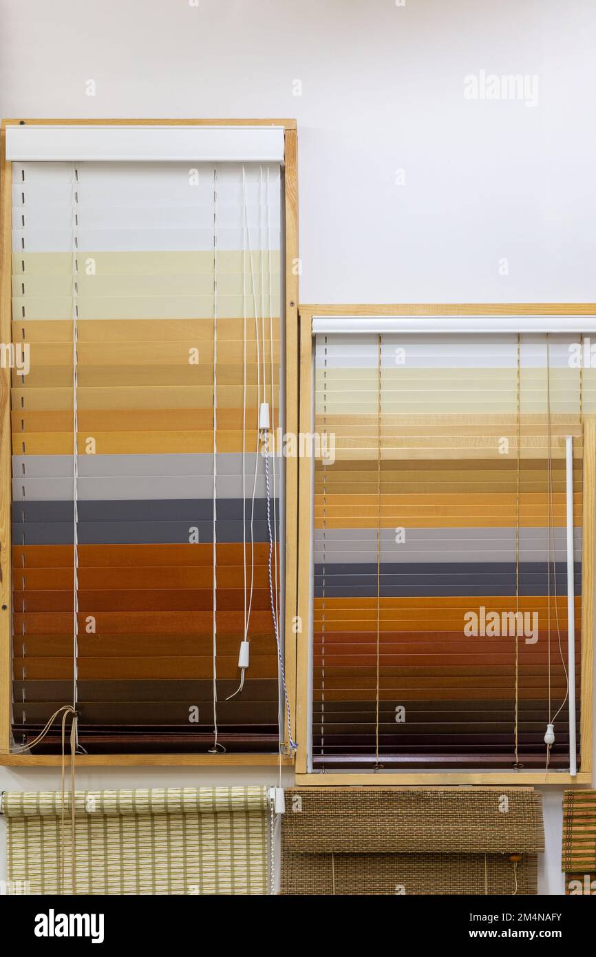 Samples of blinds for windows in the store. Plastic blinds, pleated ...