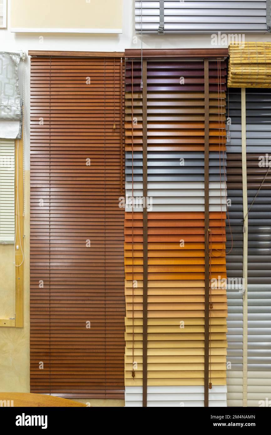 Samples of blinds for windows in the store. Plastic blinds, pleated ...