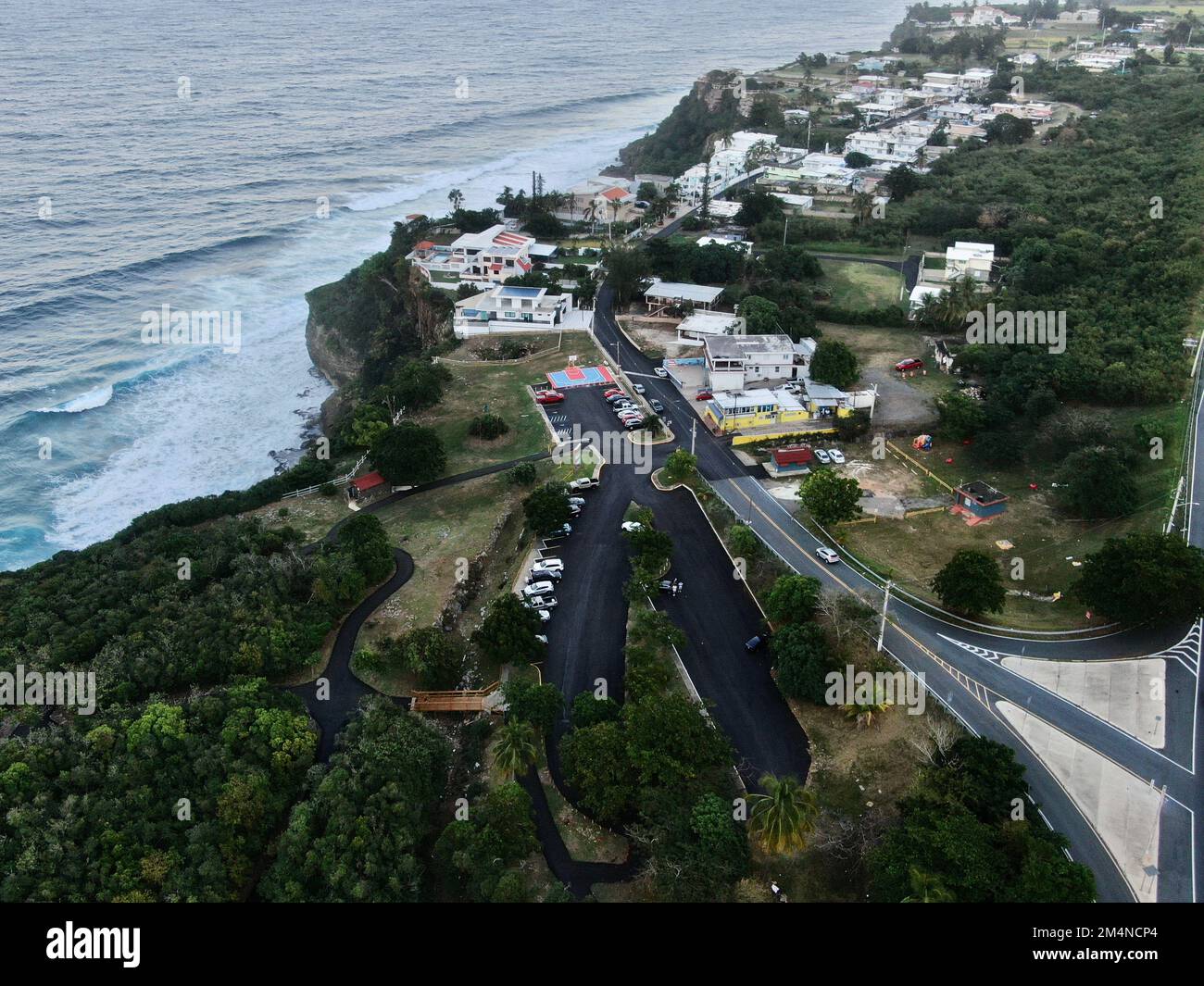 An aerial shot of the coastal town of Quebradillas in front of a ...