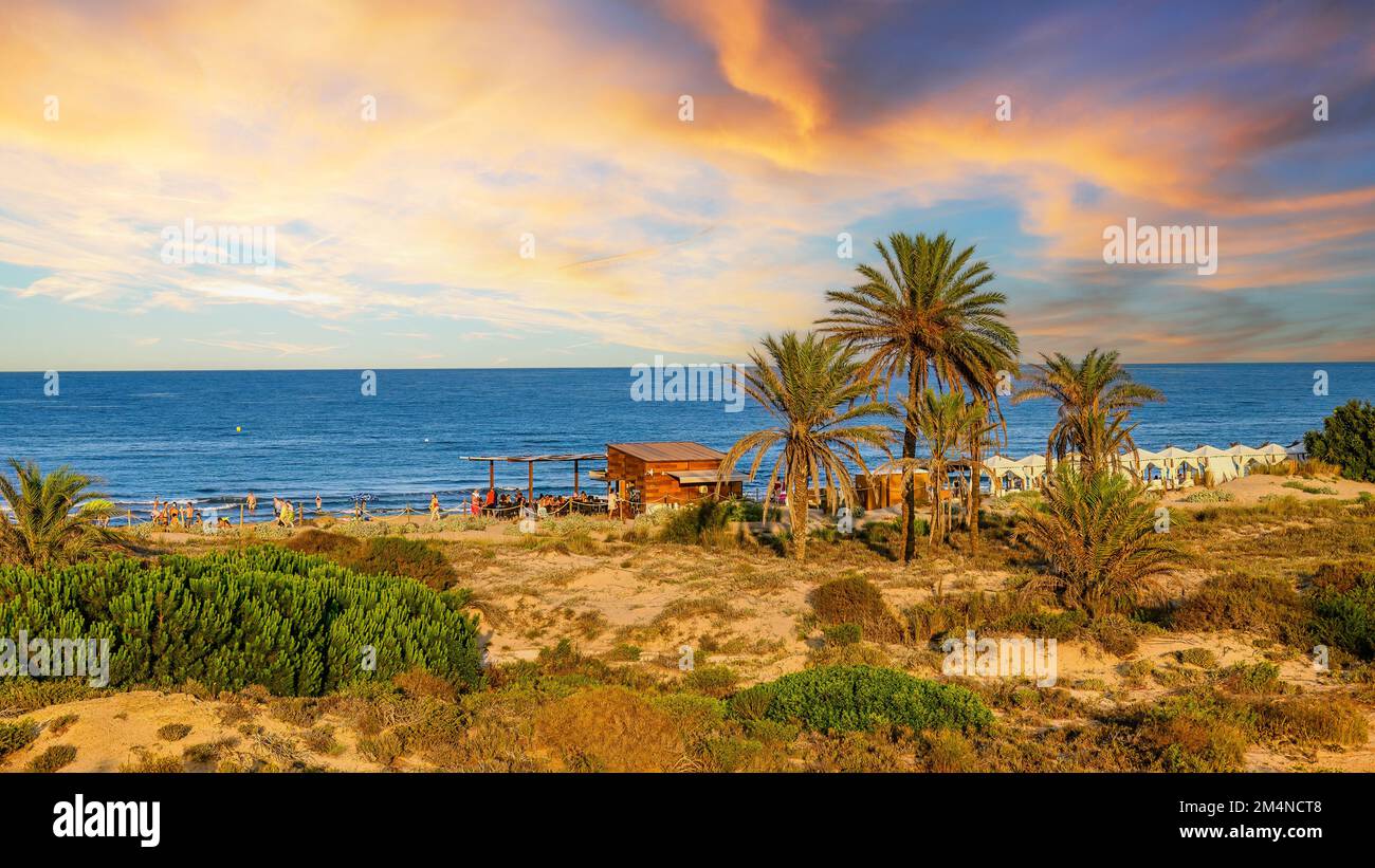 Elche beach in the golden dusk light. Landscape and scenic in the ...