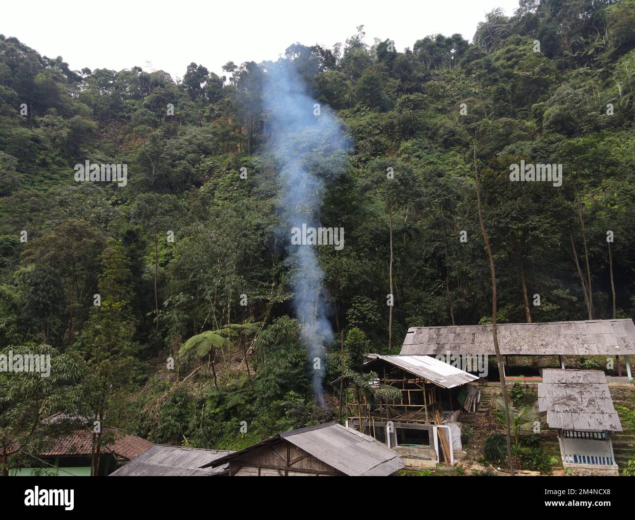 A closeup shot of a village near Bogor waterfalls during the winter as ...
