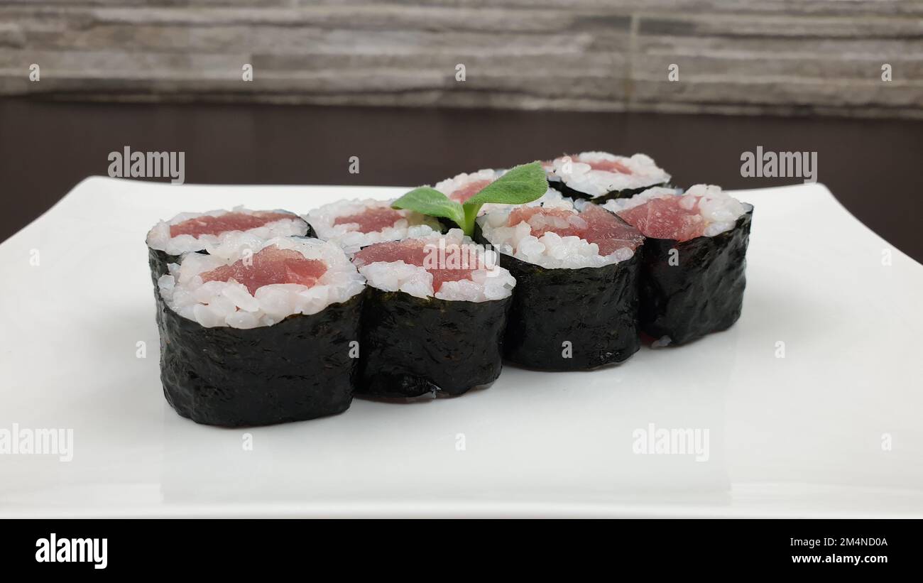 A closeup shot of a white plate filled with eight pieces of delicious ...