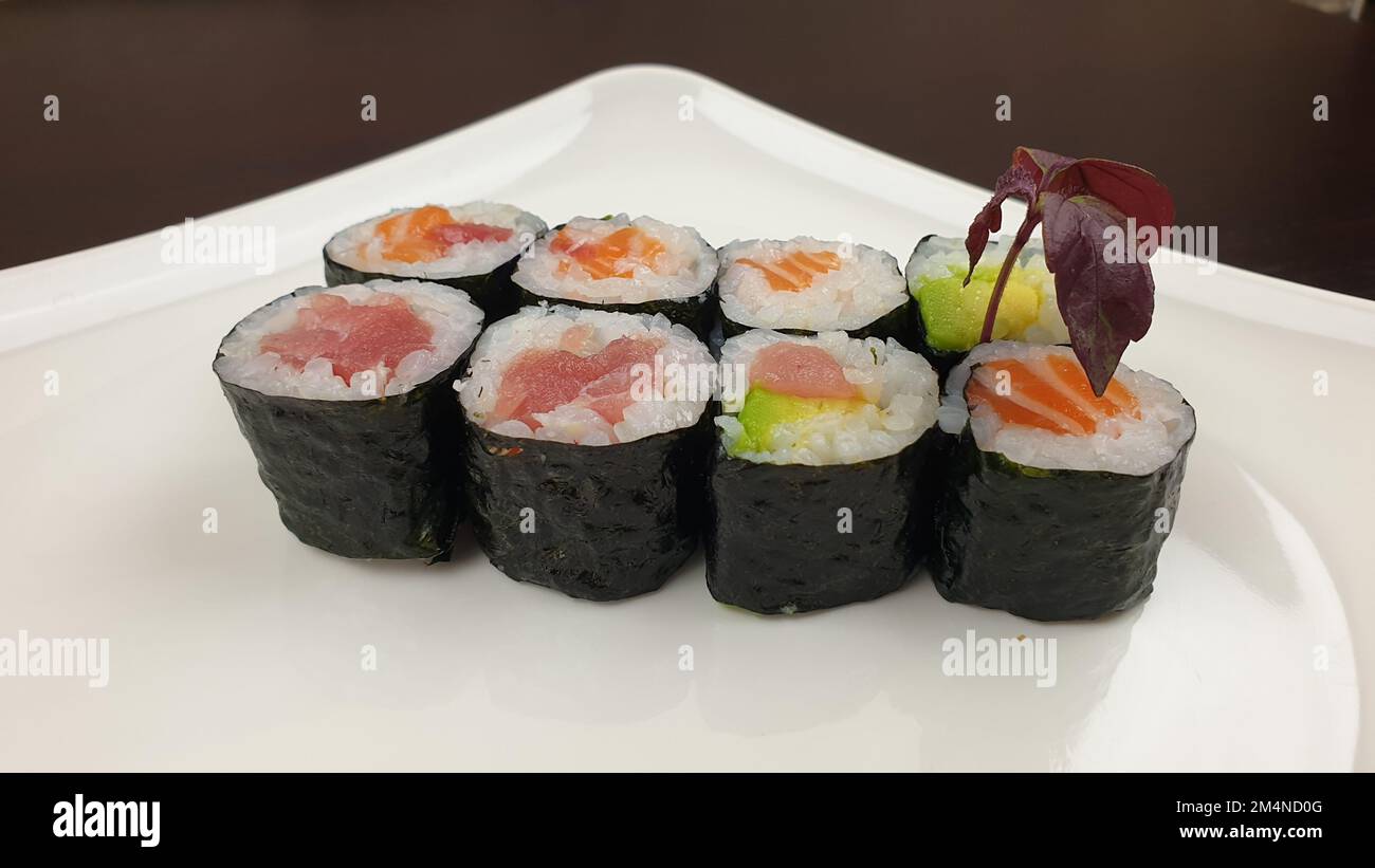 A closeup shot of a white plate filled with eight pieces of delicious ...