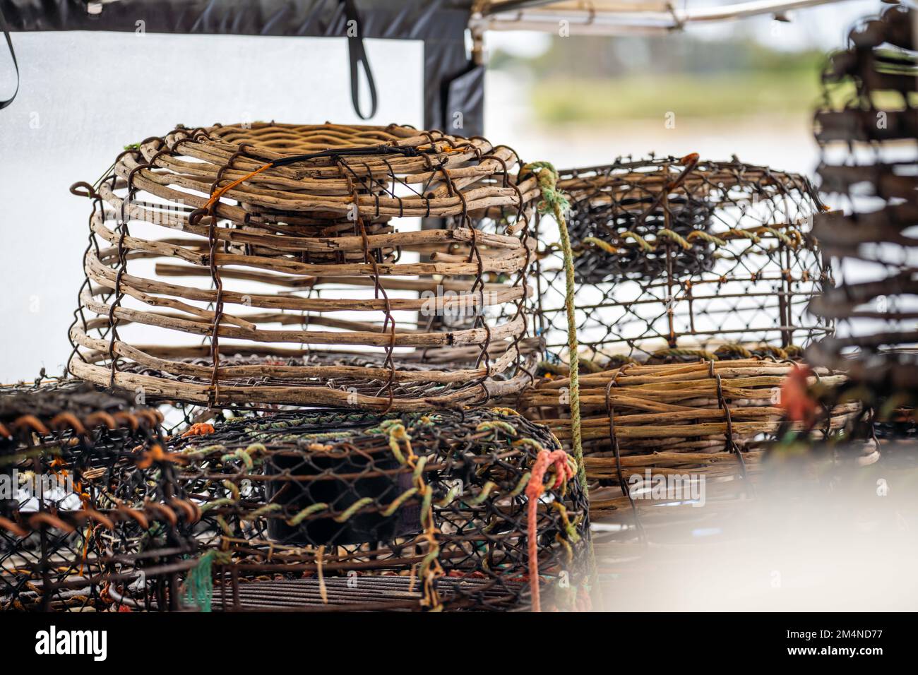 crayfish traps on a fishing boat. lobster wooden pots on the back of a ...