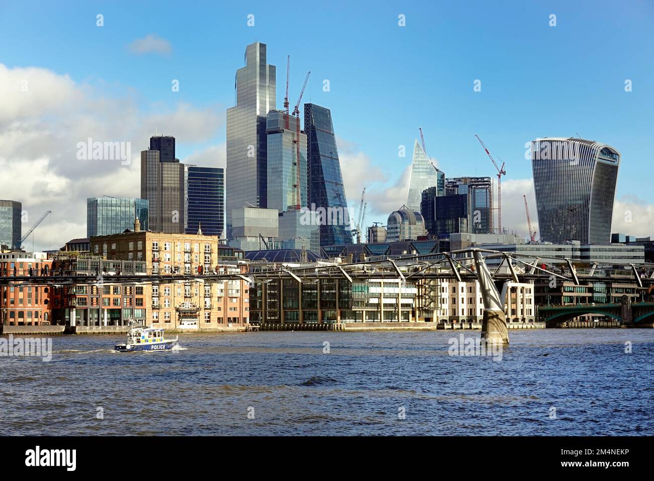 Police patrol boat passing the Millennial Bridge in front of the City ...