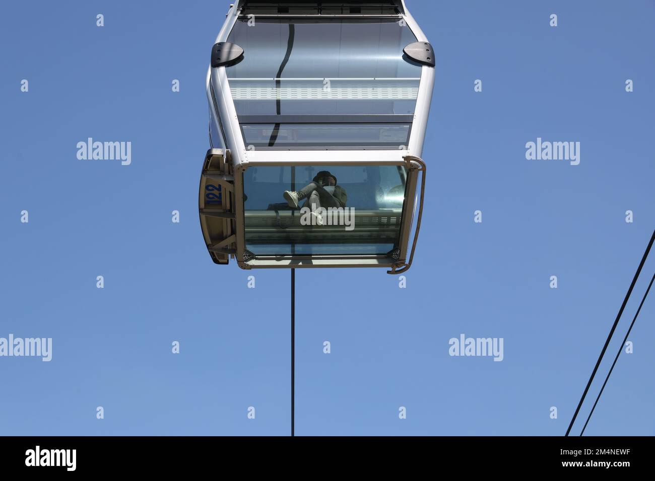 Visitors ride on the Crystal+ cabin Ngong Ping 360 cable car in Lantau ...