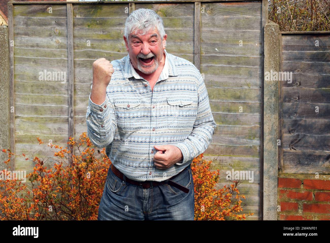 Elderly or senior man saying yes, good result. Happy with the outcome ...