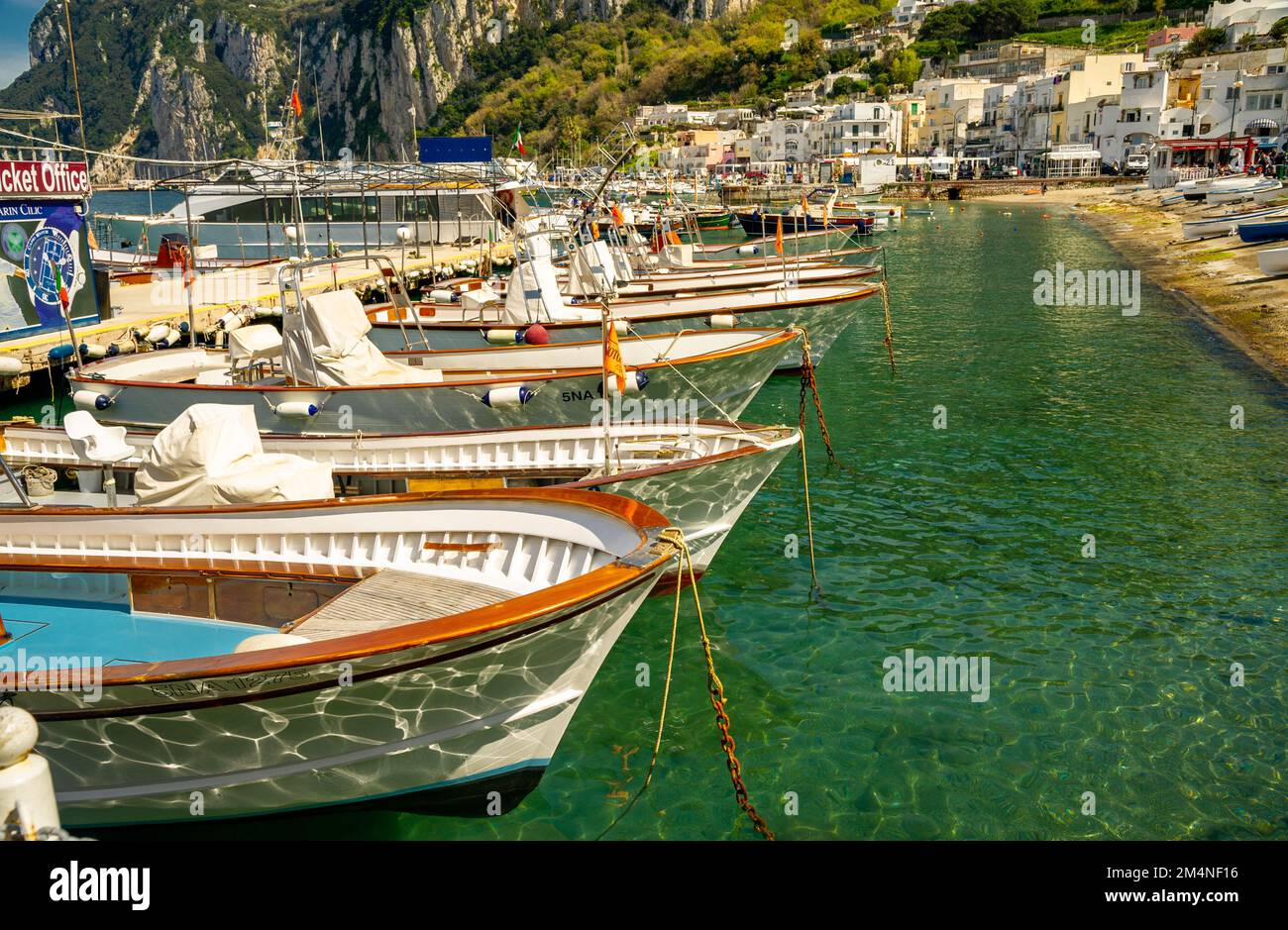 April 23 2022-Boats ashore in the port of Capri with azure water Stock ...