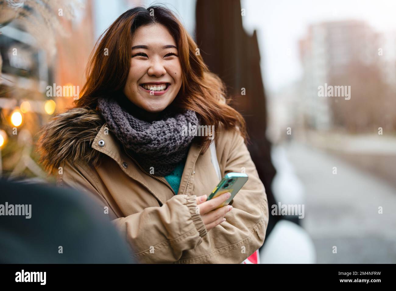Mobile phone bus stop woman hi-res stock photography and images - Alamy