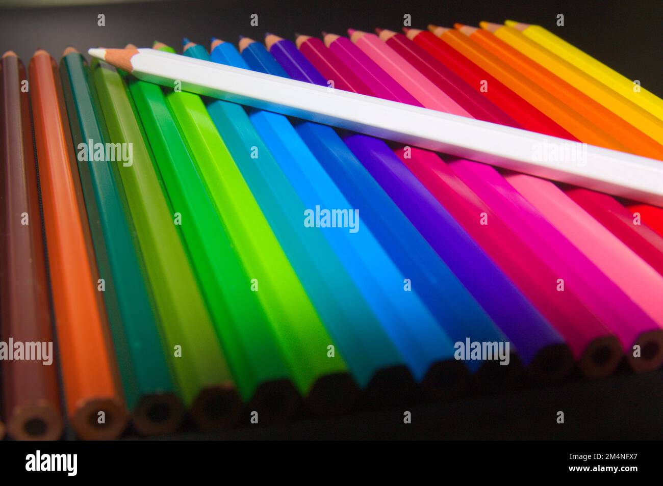 Detail of some wooden pencils of multiple colors ordered by color like ...