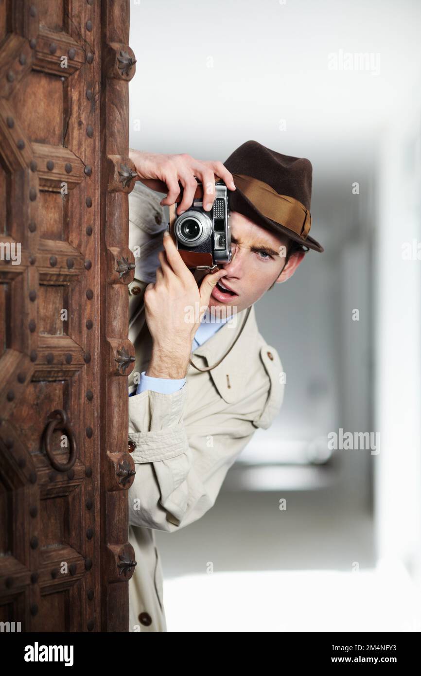 FlashHes got the shot. Private detective capturing a photo suspiciously ...