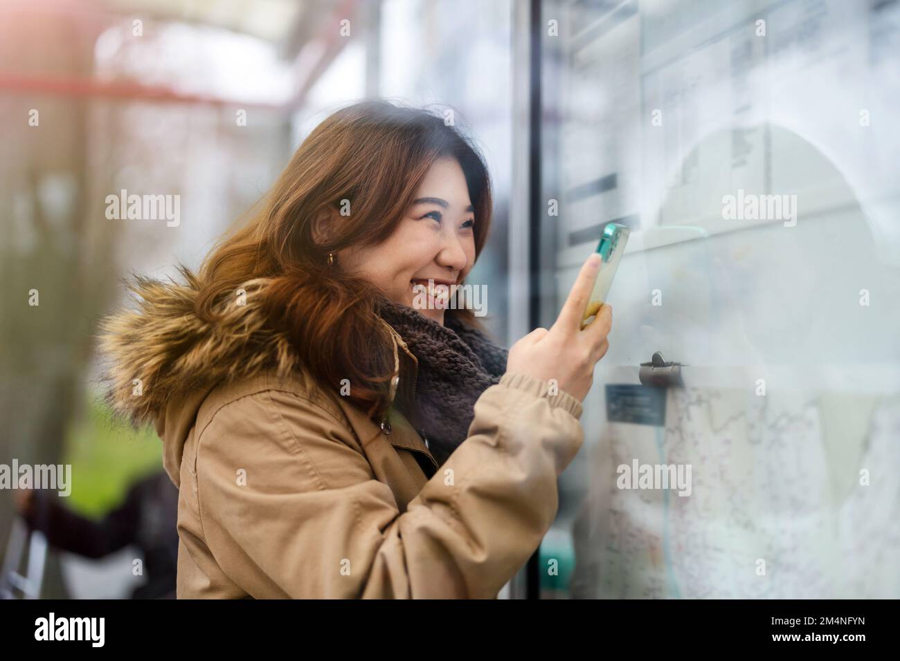 Asian female student at bus stop hi-res stock photography and images ...